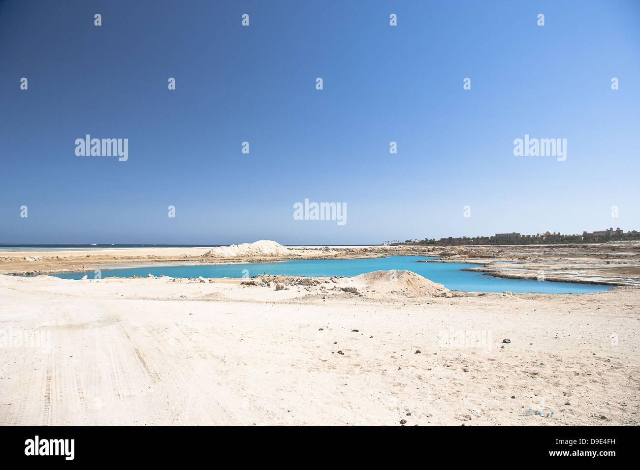 Amazing Blue lake among the sand and rocks Stock Photo - Alamy