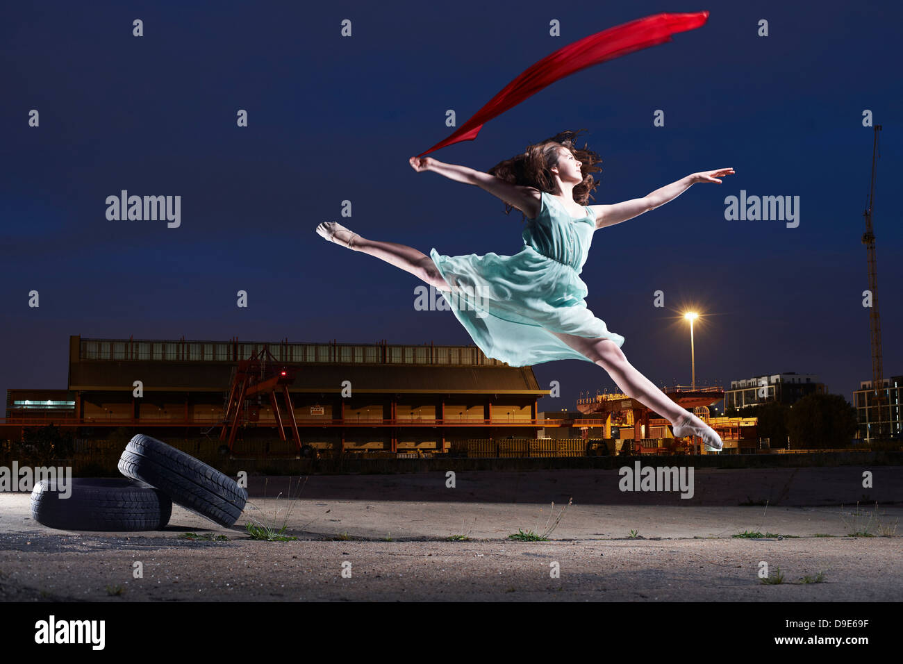 Young female dancer leaping in urban environment Stock Photo - Alamy