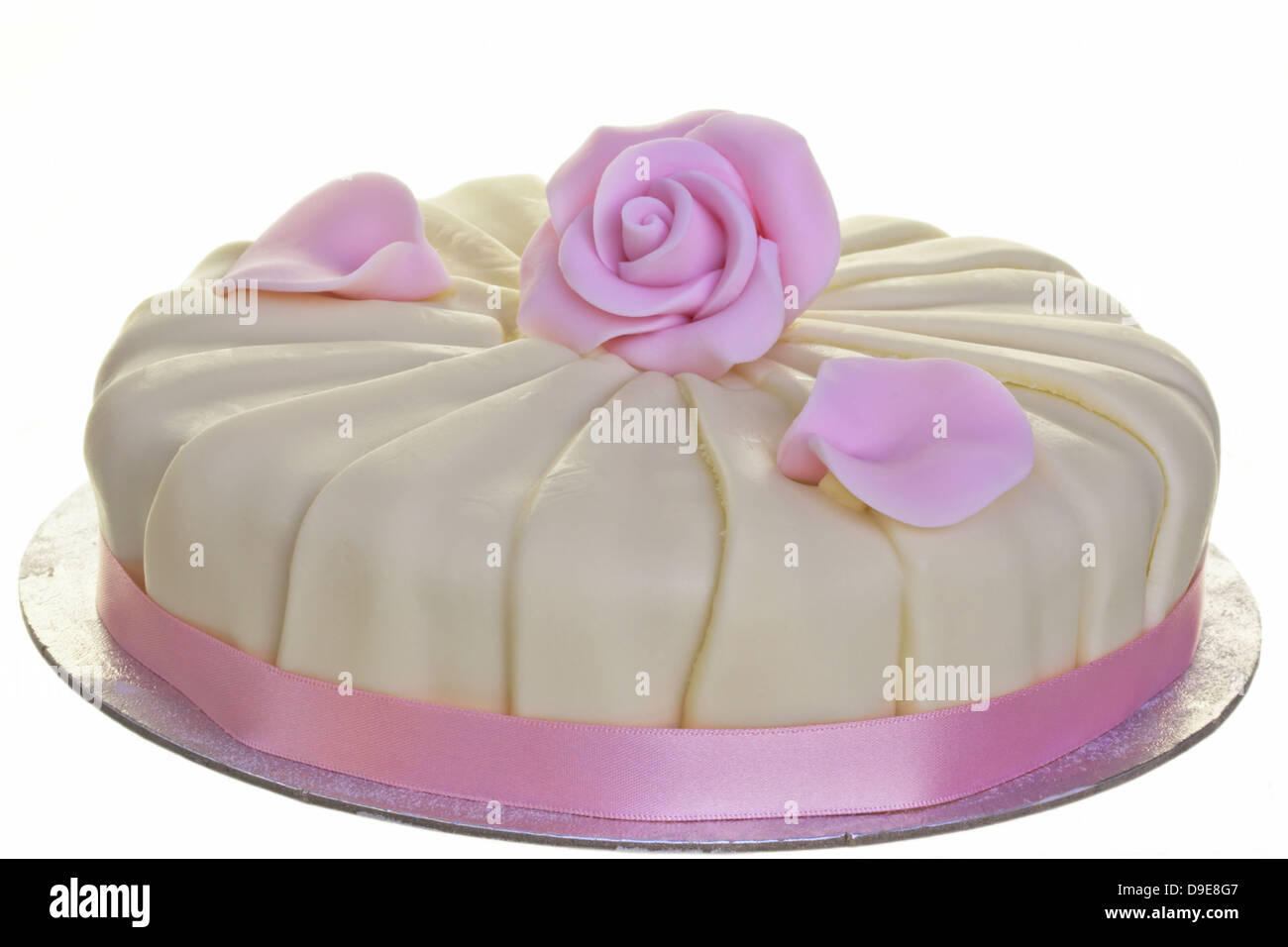 Iced white and pink cake isolated on white Stock Photo - Alamy