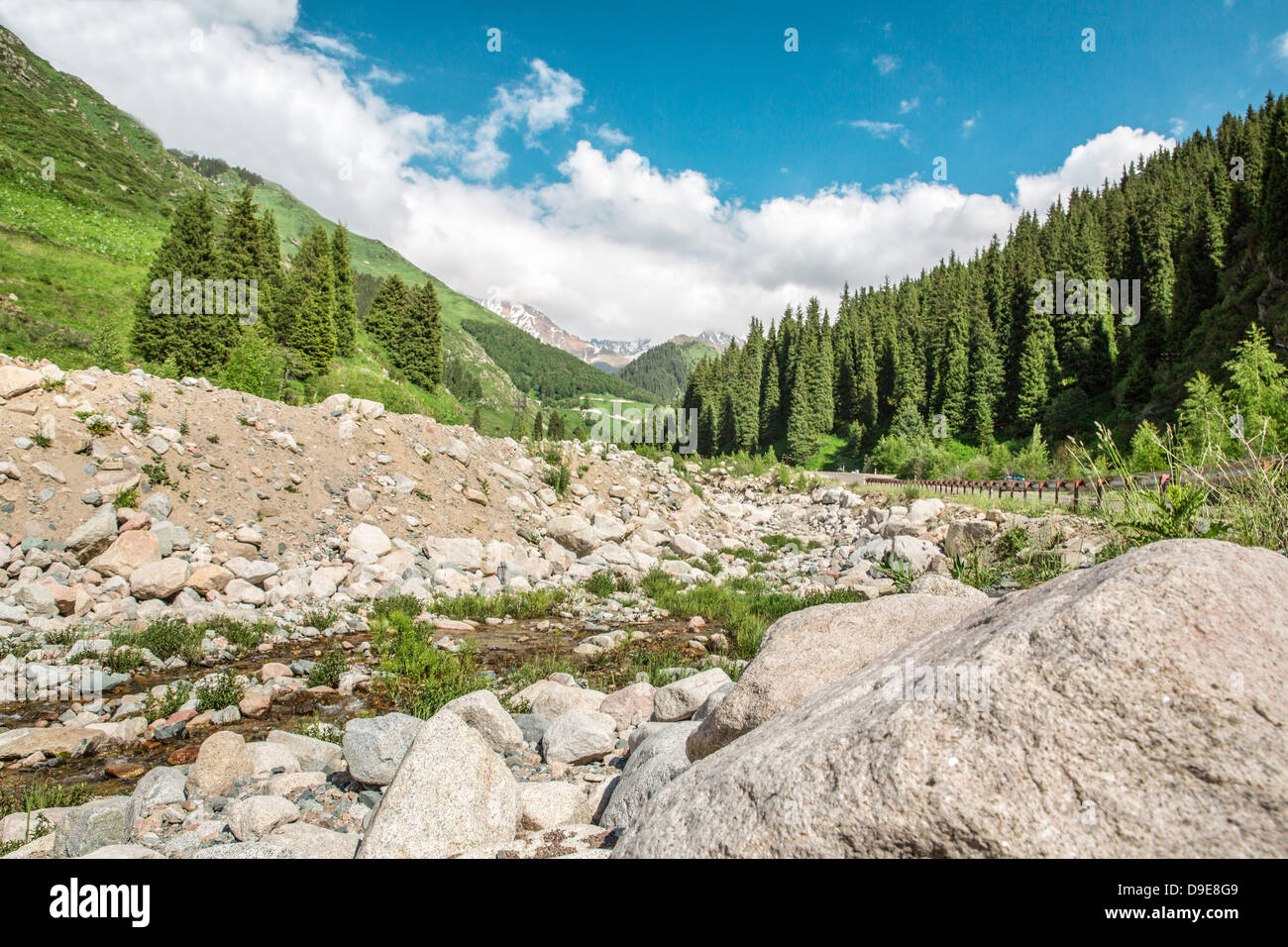 Road on Big Almaty Lake, nature green mountains and blue sky in Almaty ...