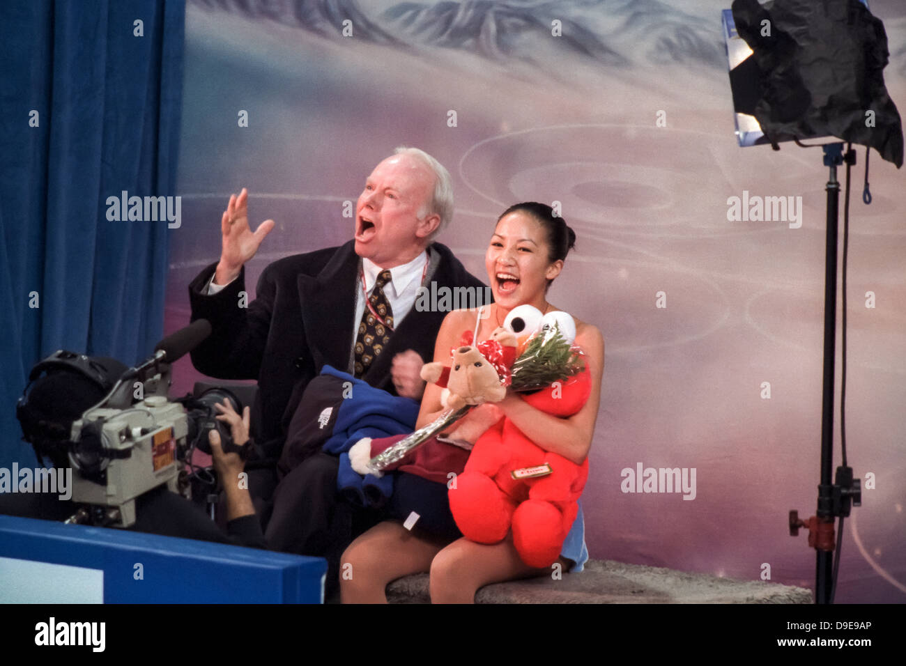 Michelle Kwan (USA) with coach Frank Carroll reacting to her scores at ...