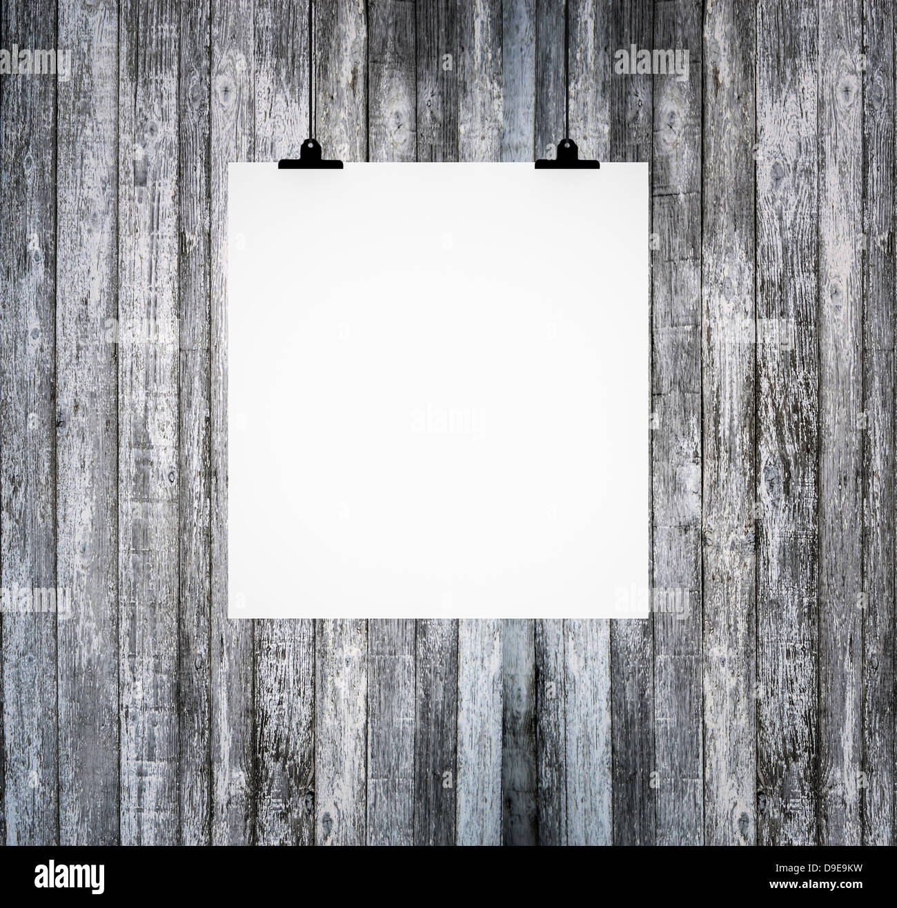 Blank paper board hanging on grunge wooden wall Stock Photo - Alamy
