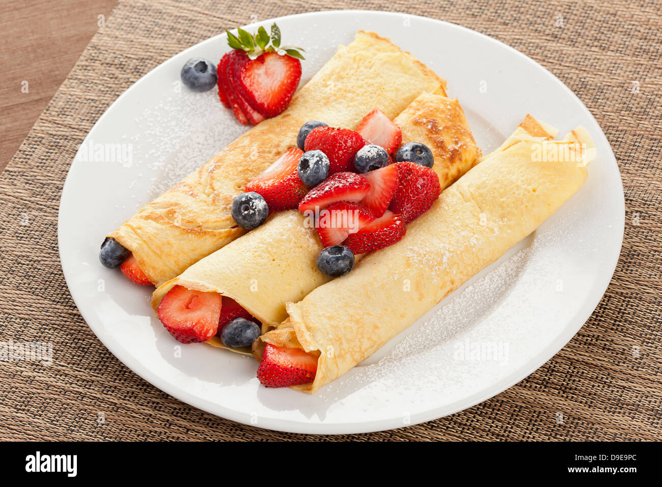 Fresh Homemade Rolled Strawberry Crepes with blueberries Stock Photo ...
