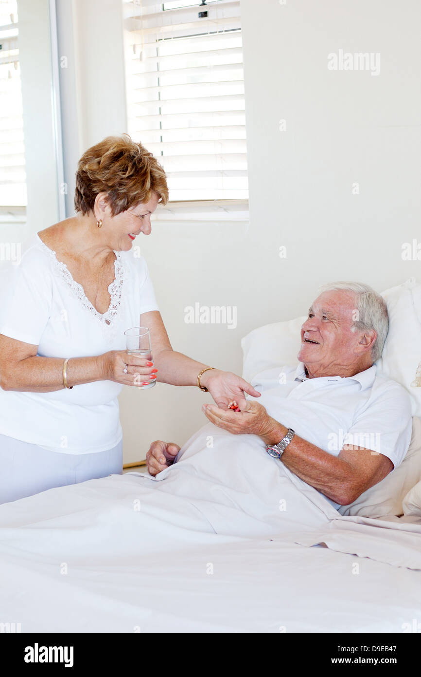 Loving husband caring sick wife hi-res stock photography and images - Alamy