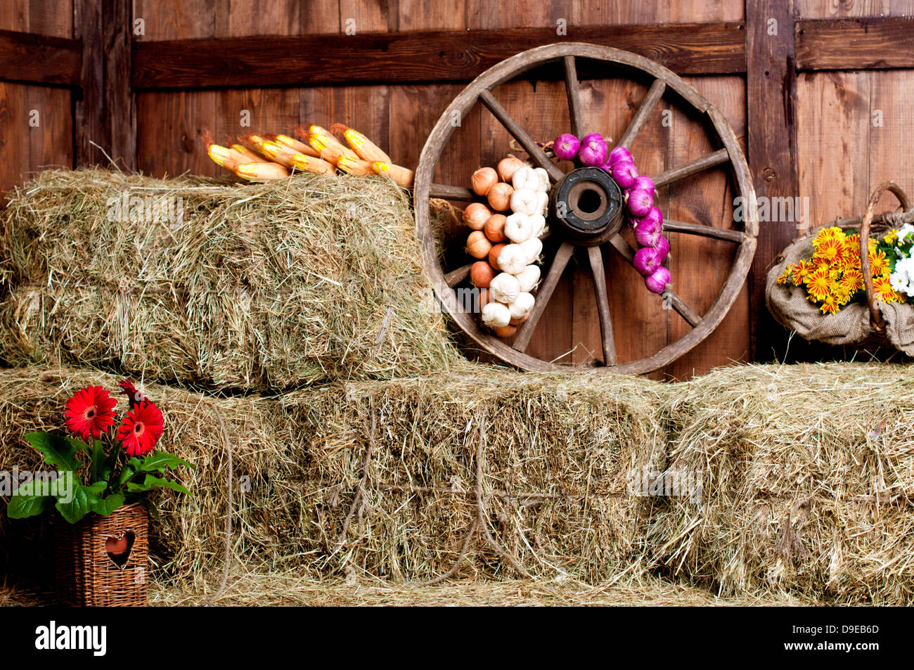 The interior of the building of the village. Wheel, hay, bucket, bottle ...