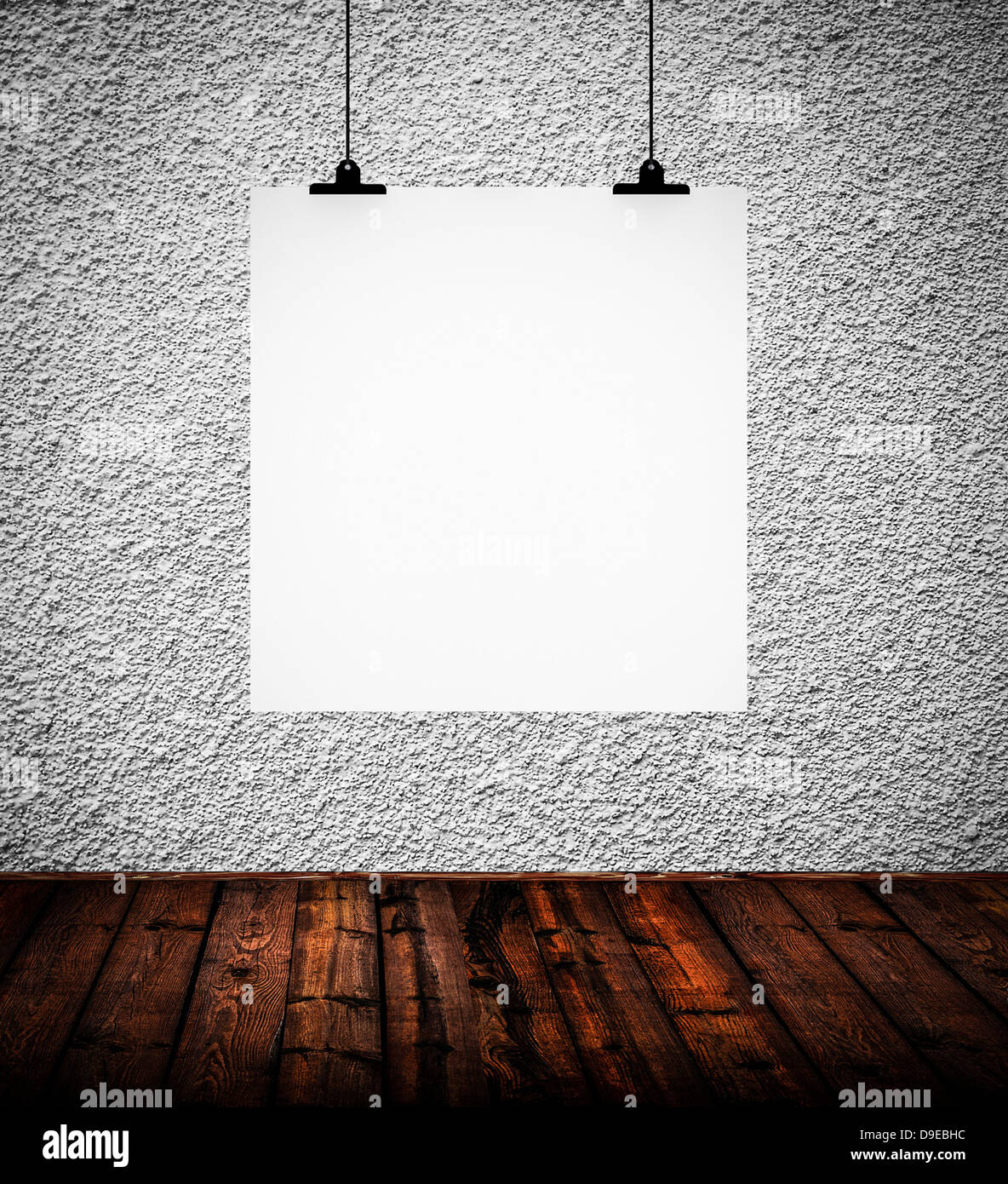 Interior of grunge empty room with white paper hanging on paper clips ...