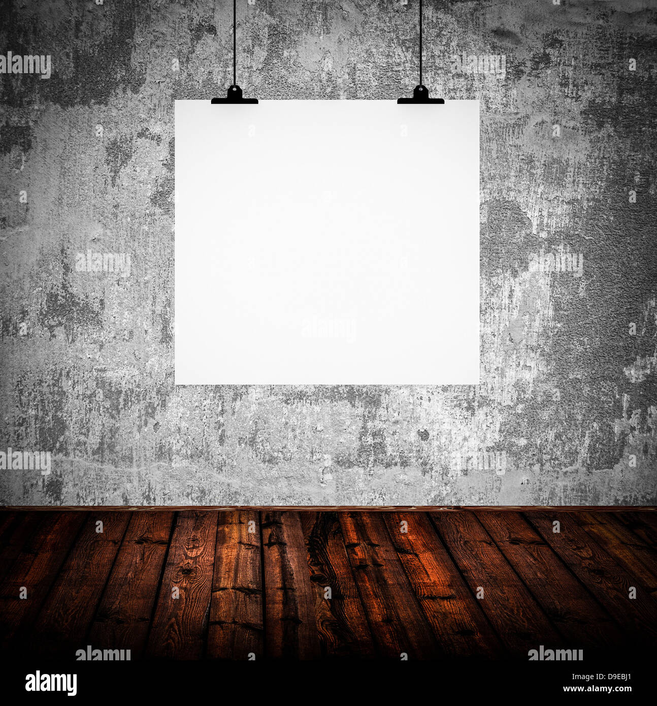 Interior of grunge empty room with white paper hanging on paper clips ...