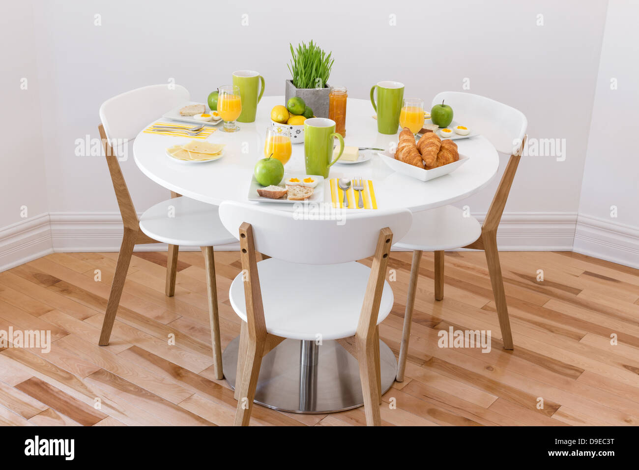 Elegant round table with tasty breakfast for three Stock Photo - Alamy