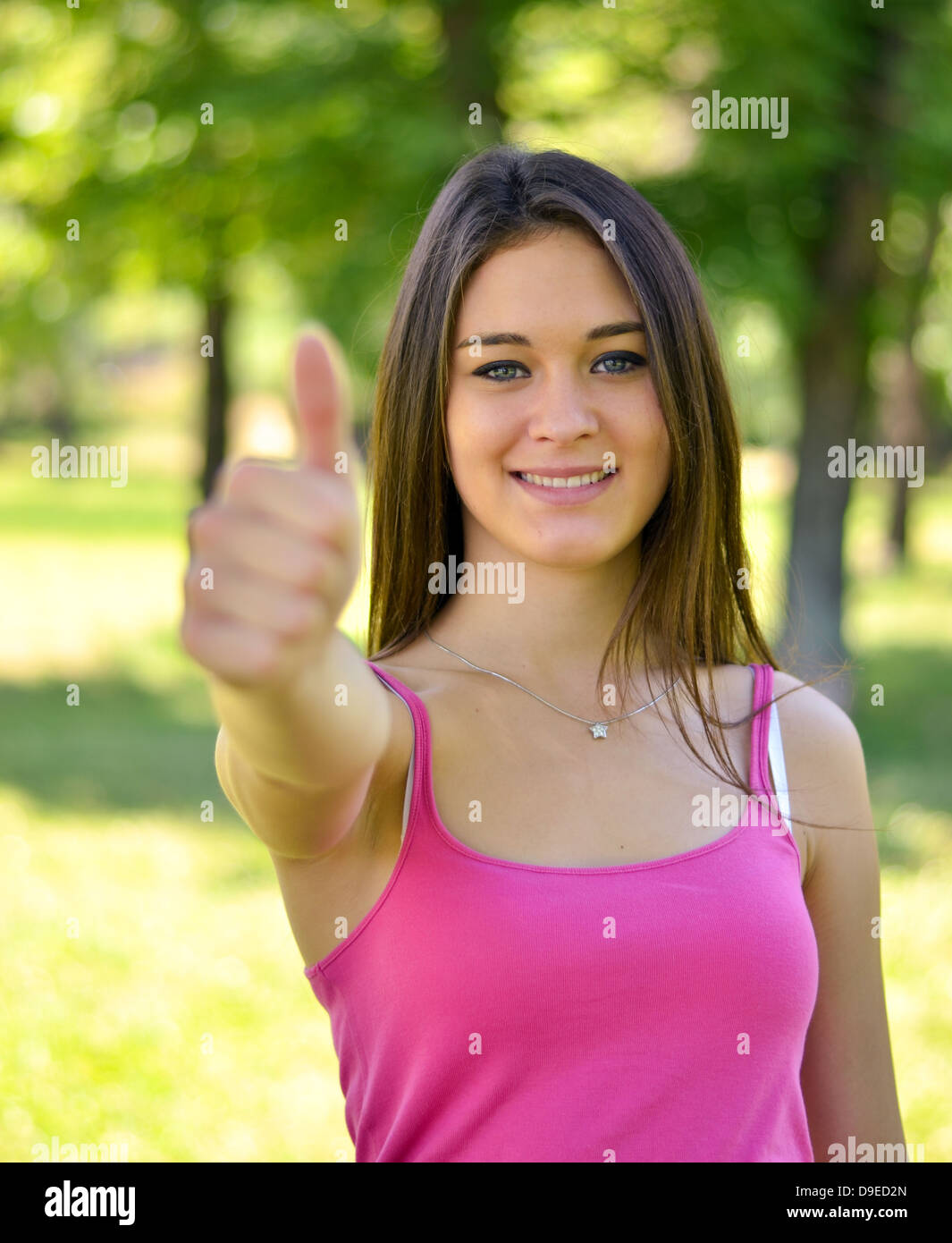 Pretty young smiling woman showing gesture that everything is ok Stock ...