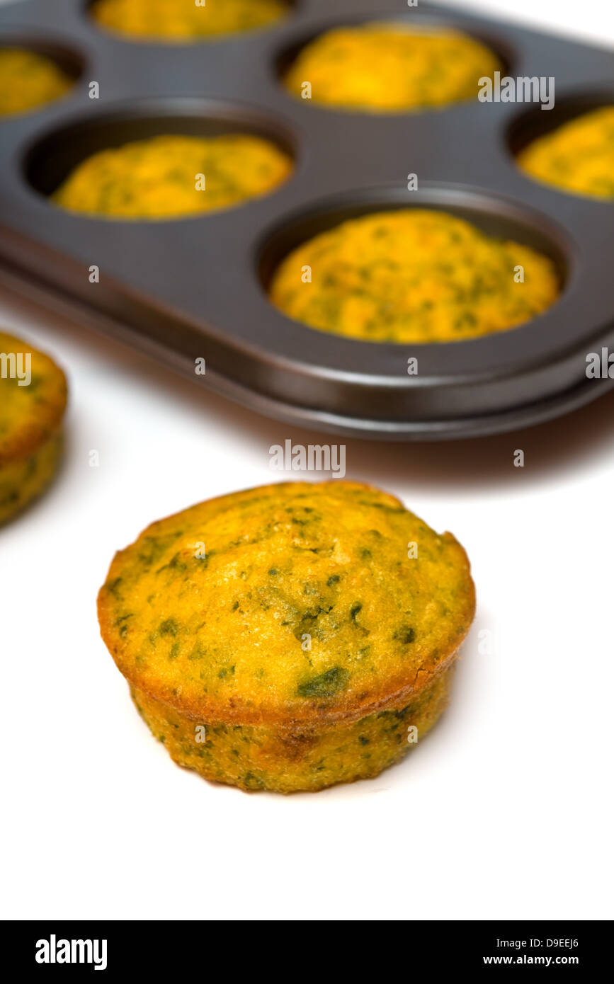 Pie mold with spinach pies over a white background Stock Photo - Alamy