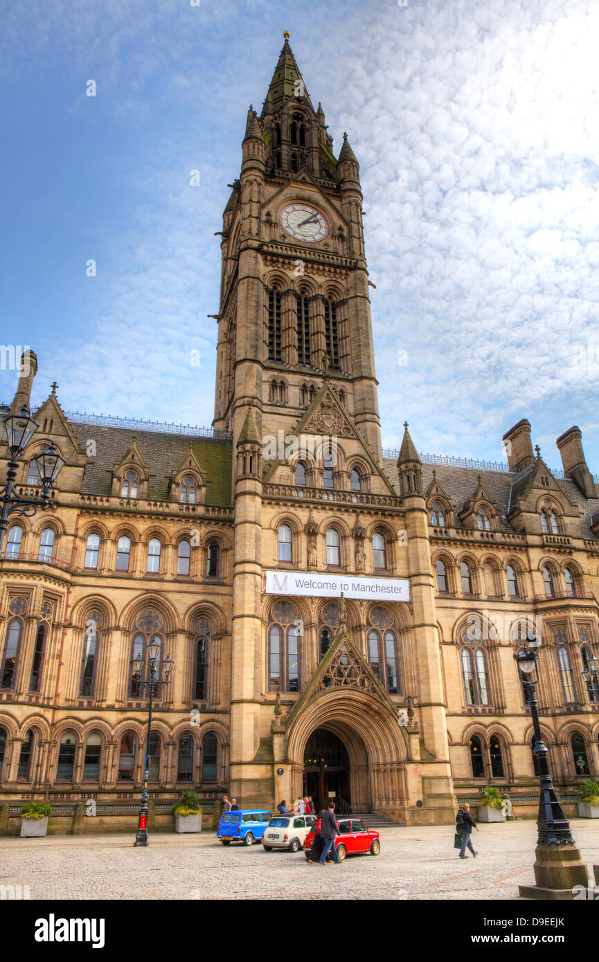 Red, white and blue mini cars parked outside Manchester Town Hall, the ...