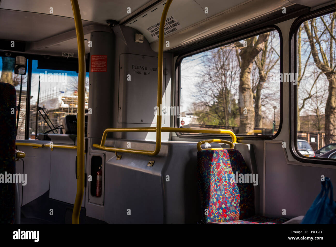 london bus empty seat yellow hand bars fire extinguisher blue shopping ...
