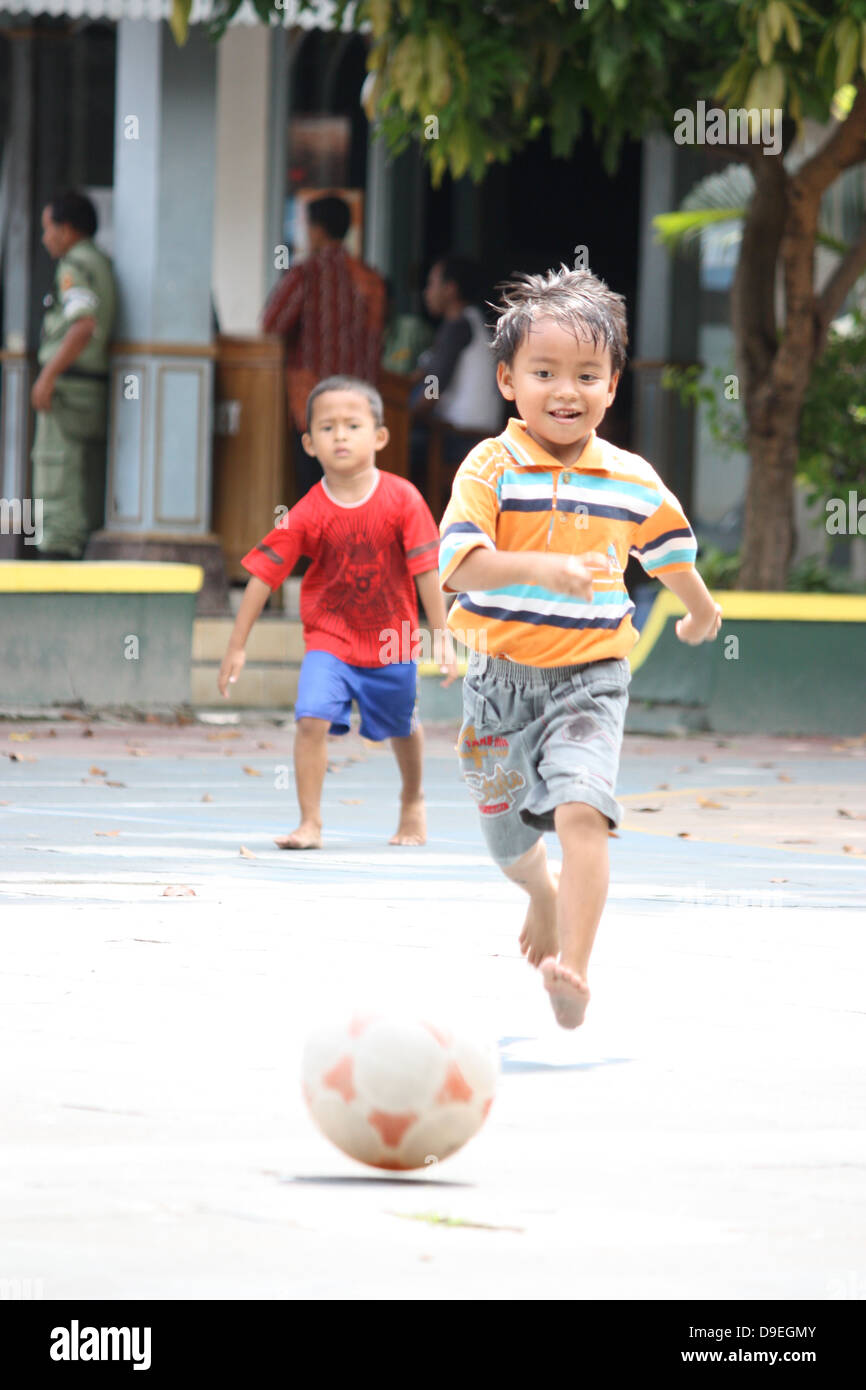 chasing the ball Stock Photo - Alamy