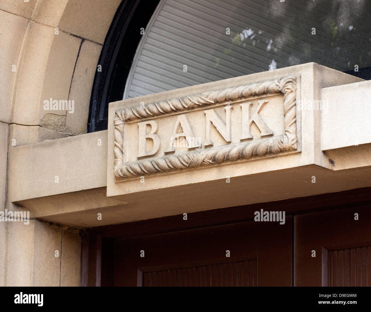 Bank sign carved in stone Stock Photo - Alamy