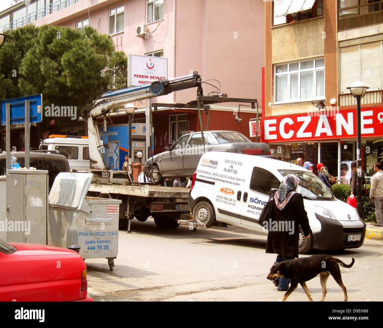 Traffic police lift a badly parked car on to a truck in the Istanbul ...