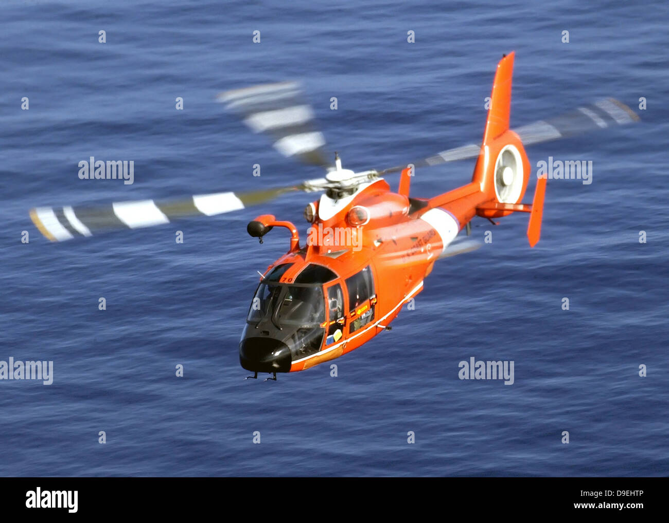 A Coast Guard HH-65A Dolphin rescue helicopter in flight Stock Photo ...