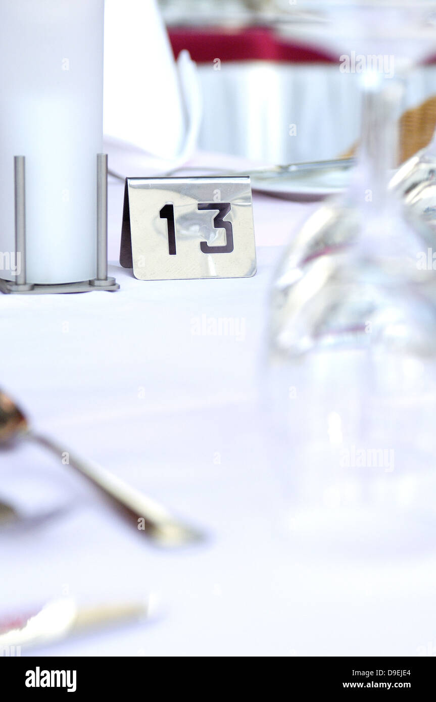 Covered hotel table with numbering Stock Photo - Alamy