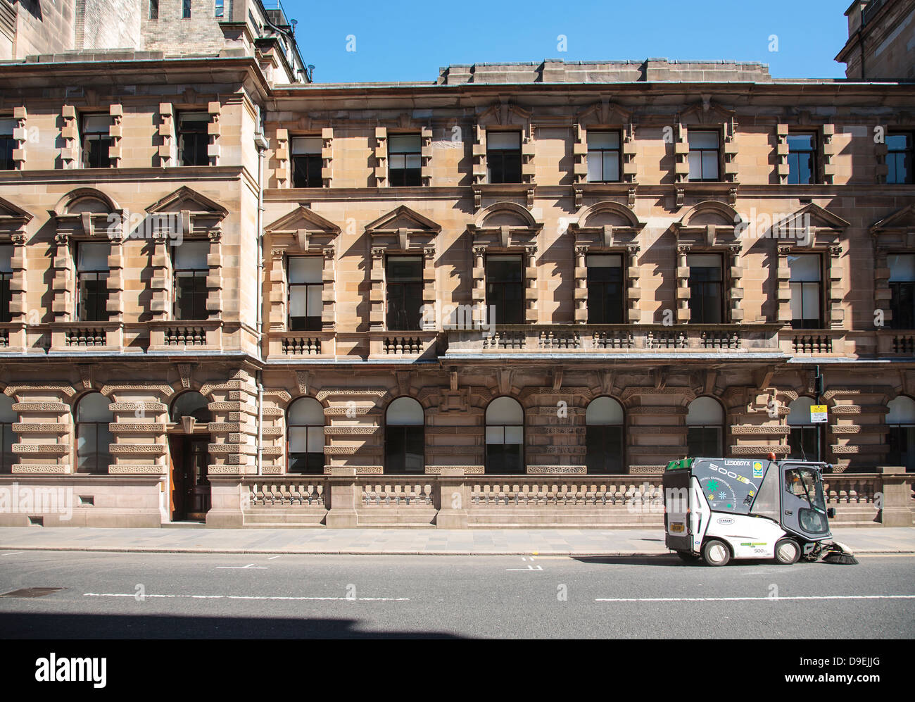 A mobile street sweeper on Cochrane Street in Glaasgow on a bright ...