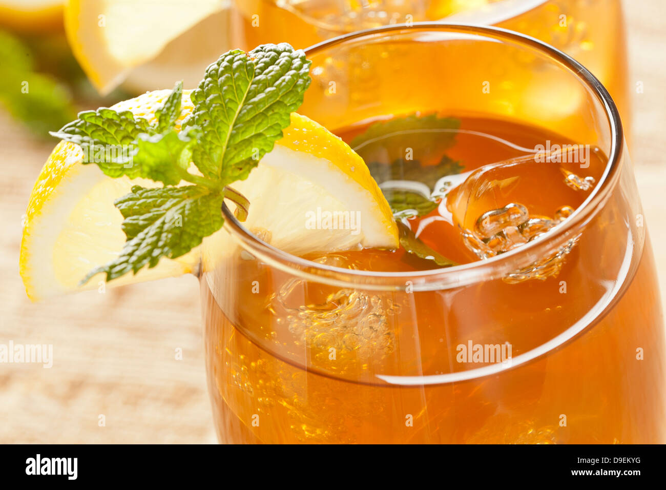 Refreshing Iced Tea with Lemon against a background Stock Photo - Alamy