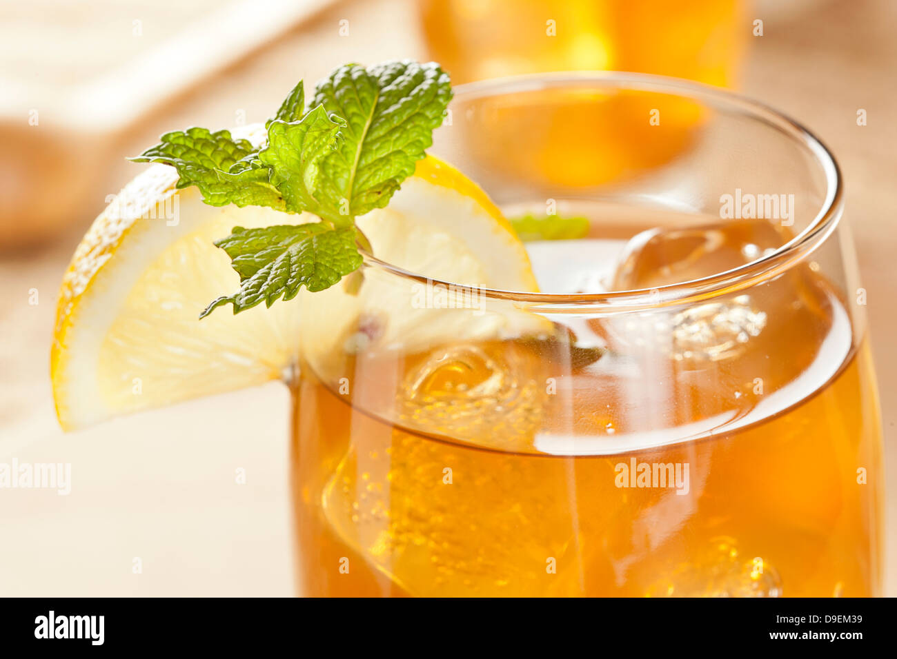 Refreshing Iced Tea with Lemon against a background Stock Photo - Alamy