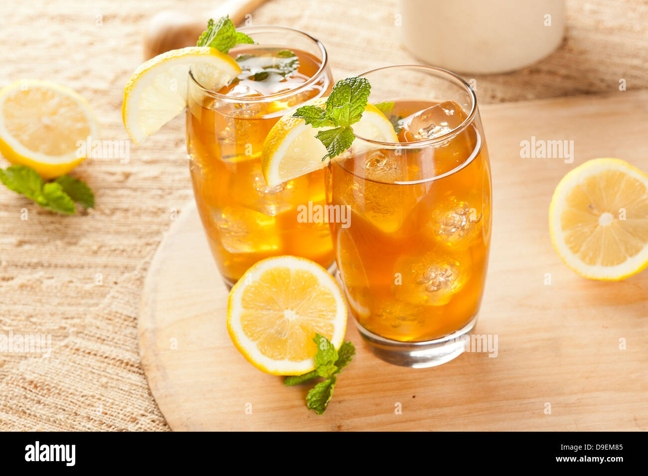Refreshing Iced Tea with Lemon against a background Stock Photo - Alamy