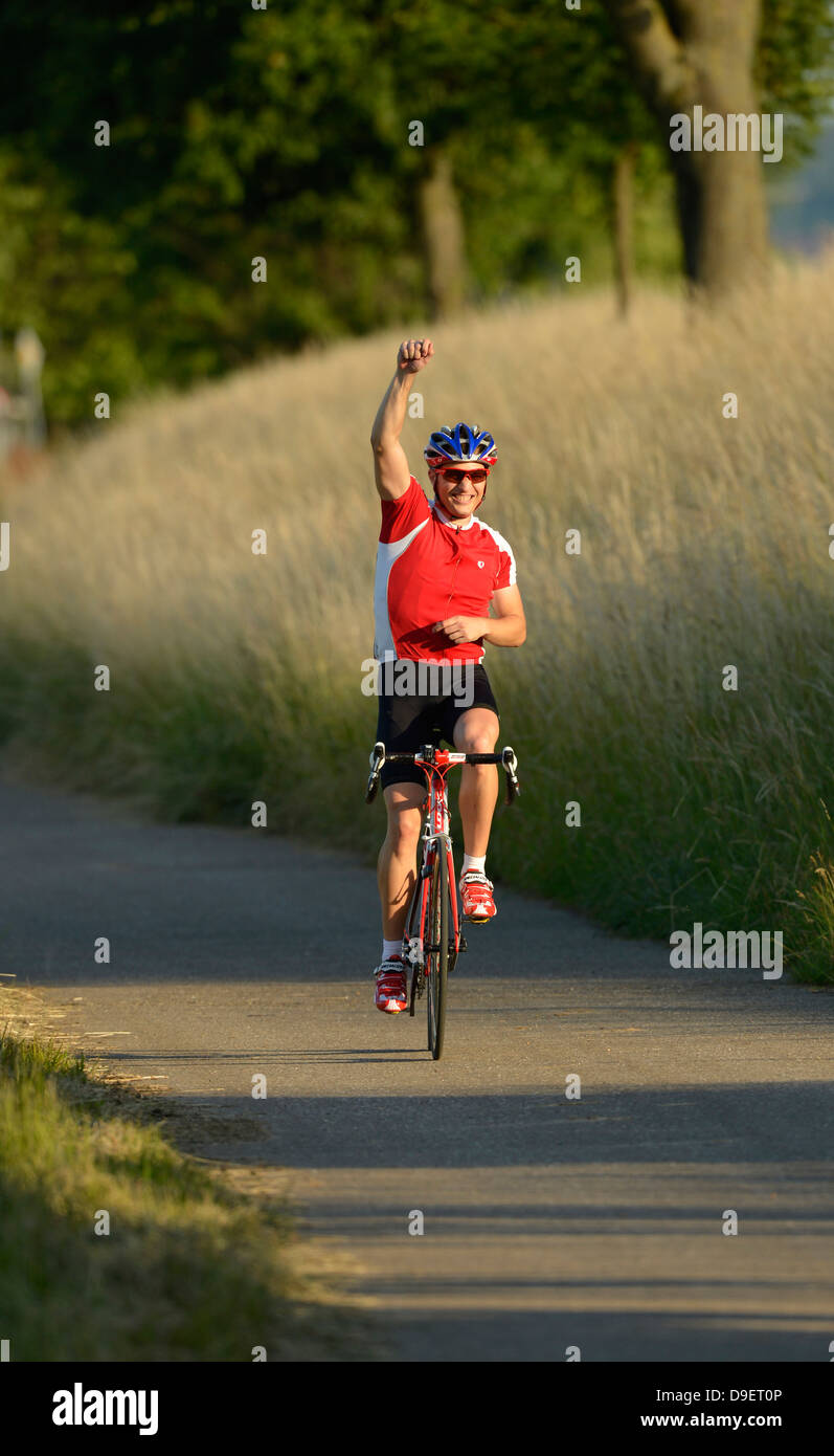Winner's pose cheering joy emotion racing cyclist professional racing ...