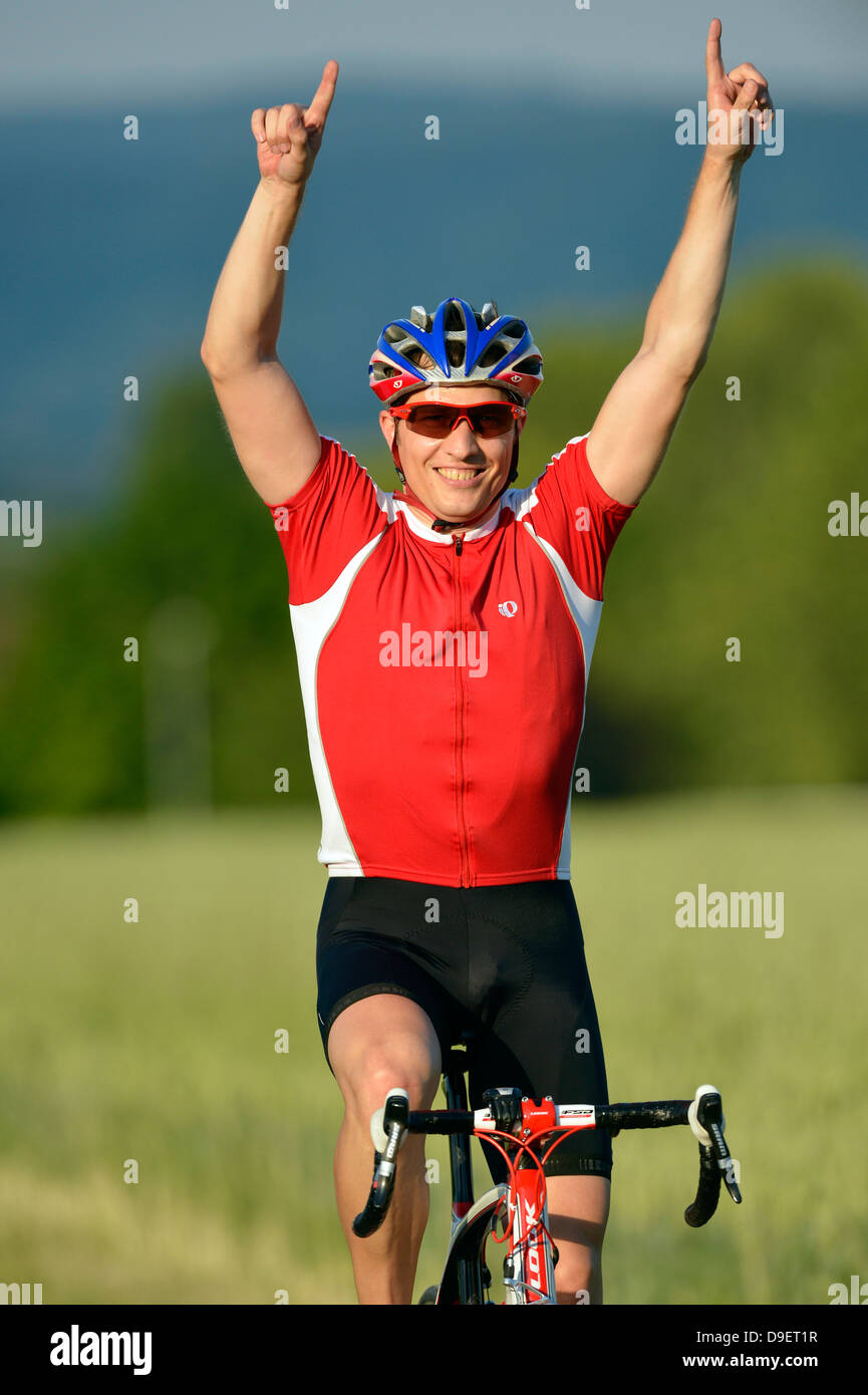 Winner's pose, cheering, joy, emotion, racing cyclist, professional ...