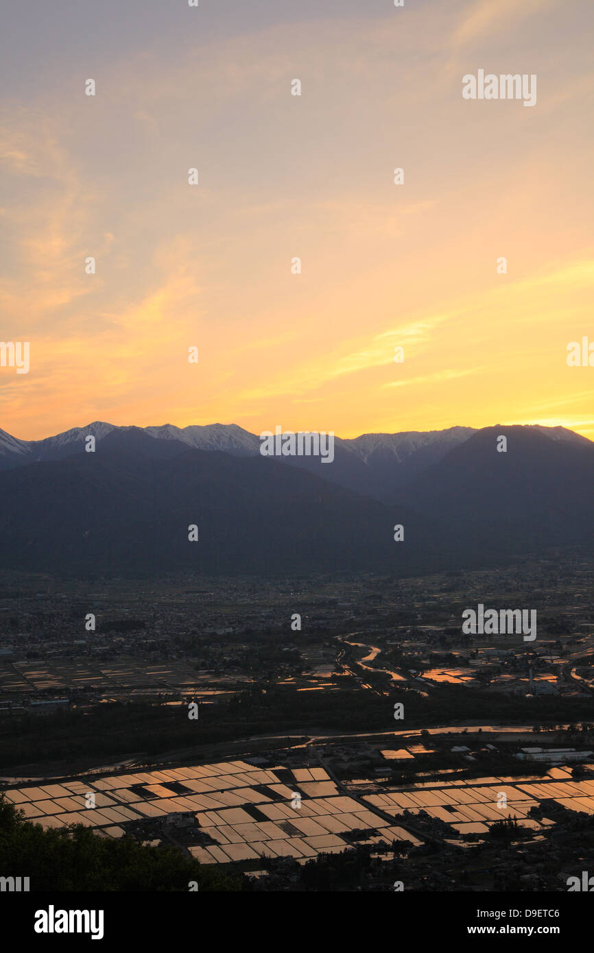 Sunset at flooded rice field in Azumino city, Nagano, Japan Stock Photo ...