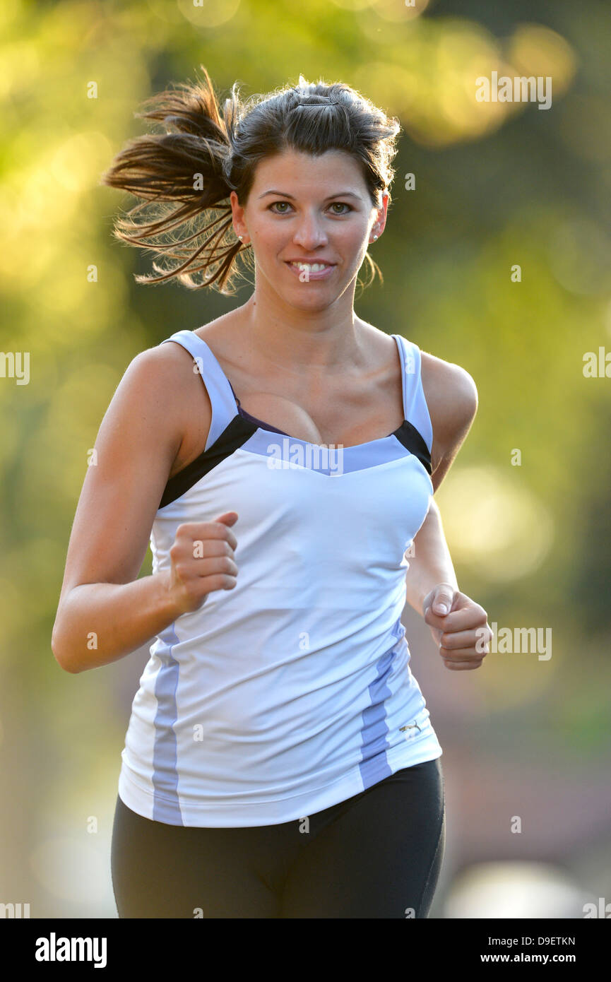Young woman jogging (Model release Stock Photo - Alamy