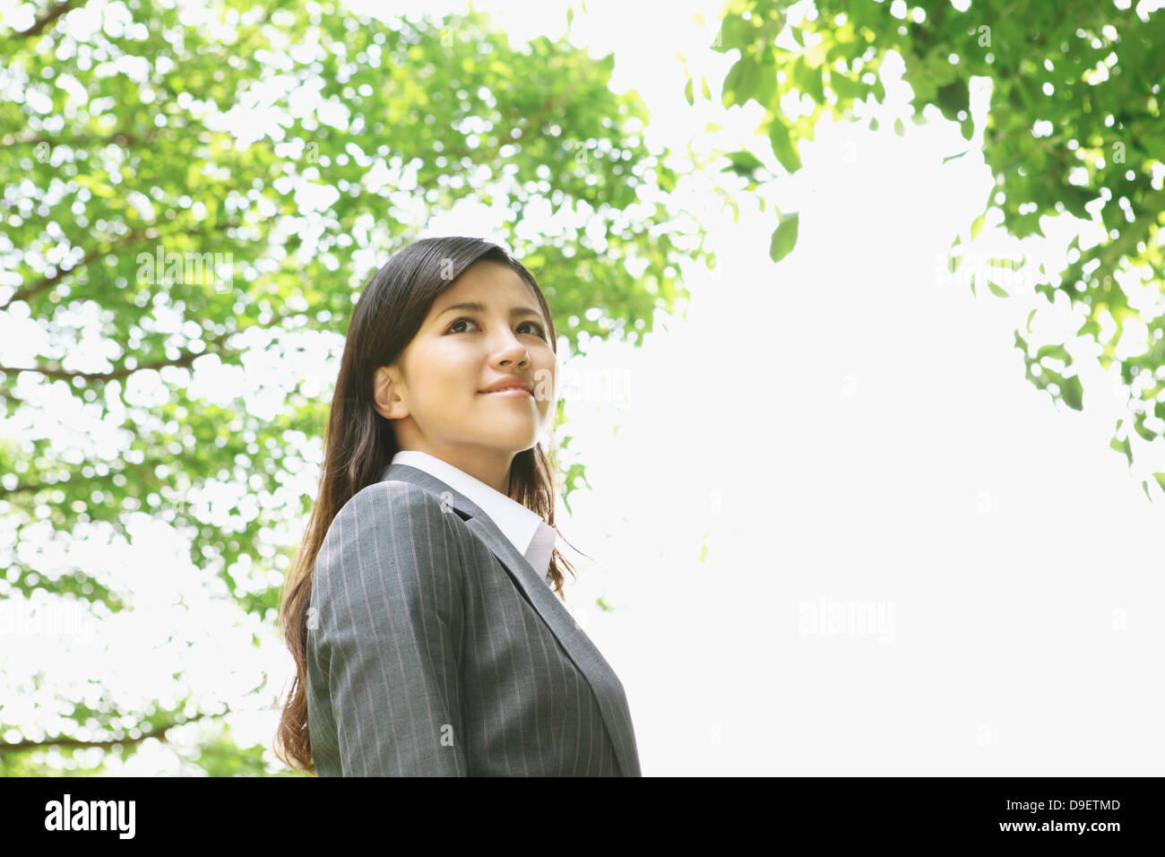 Businesswoman smiling away Stock Photo - Alamy