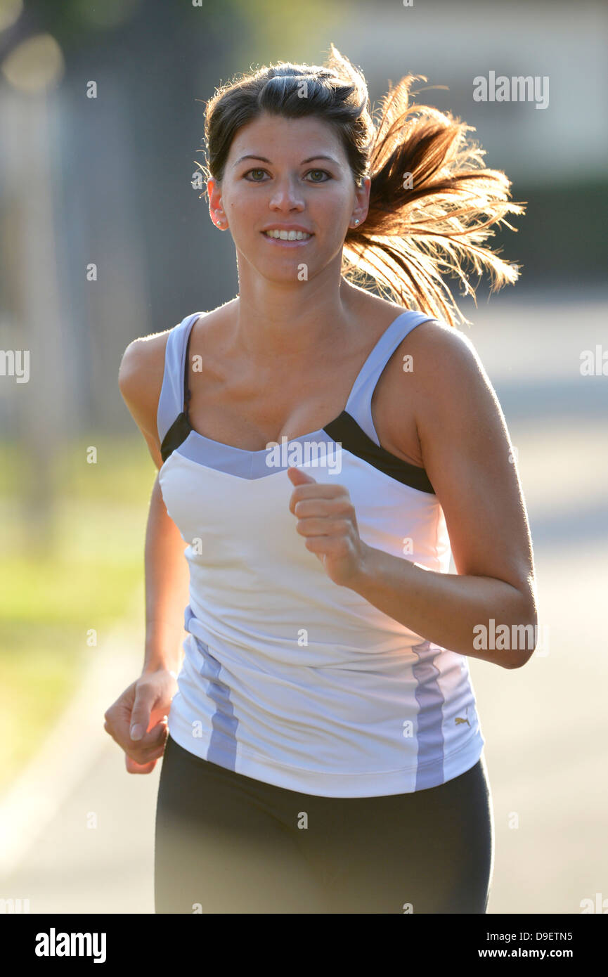 Young woman jogging (Model release Stock Photo - Alamy