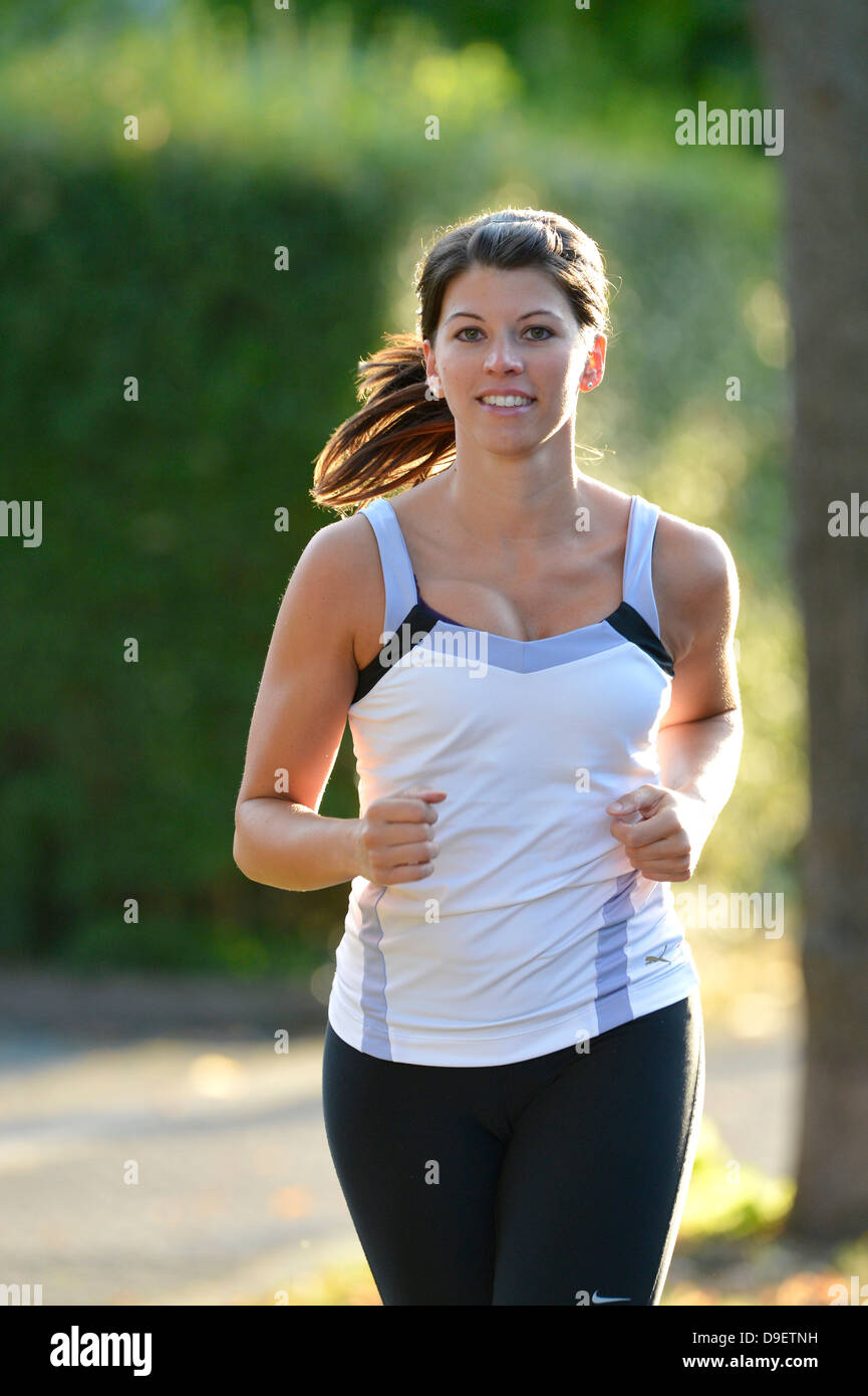 Young woman jogging (Model release Stock Photo - Alamy