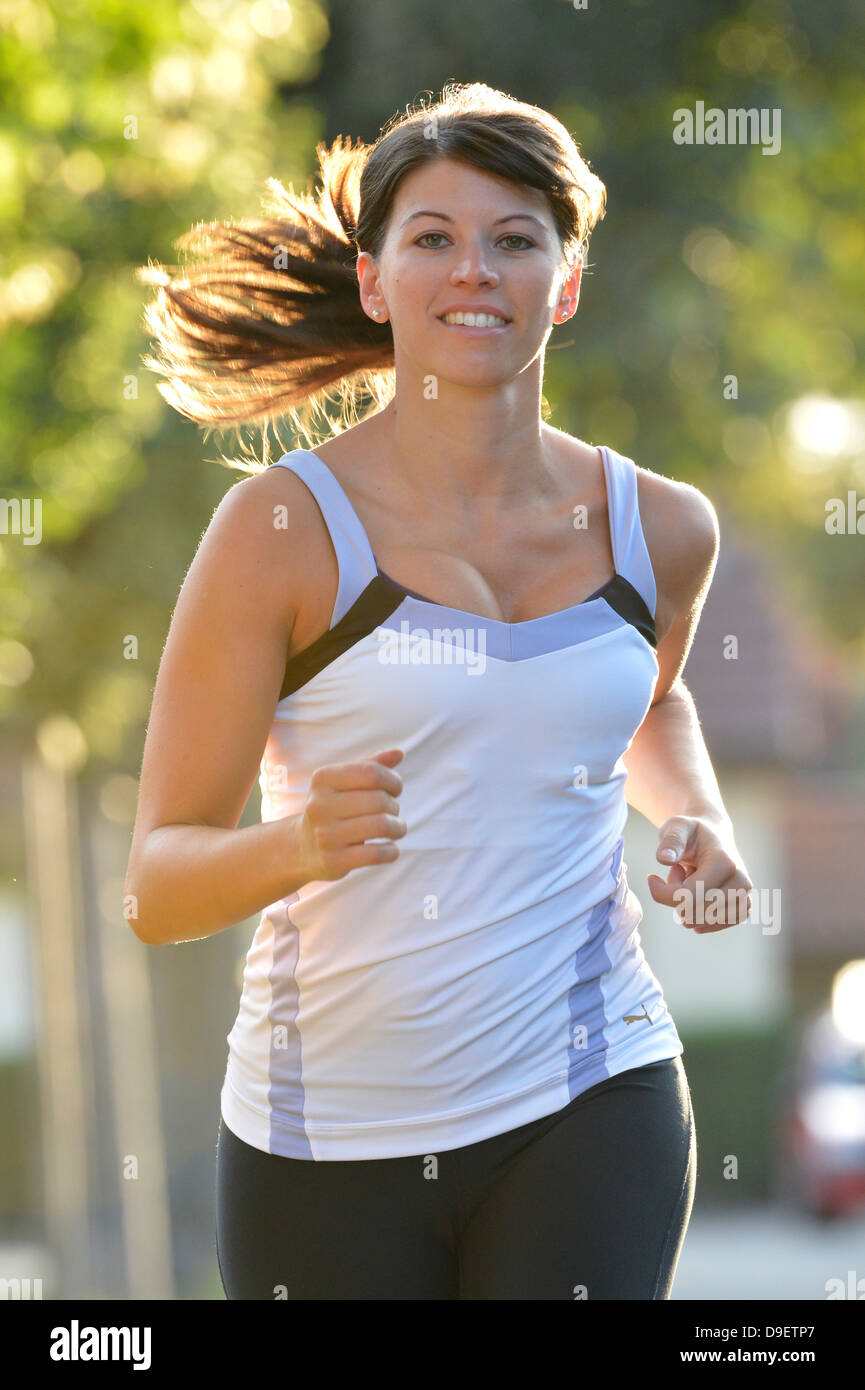 Young woman jogging (Model release Stock Photo - Alamy