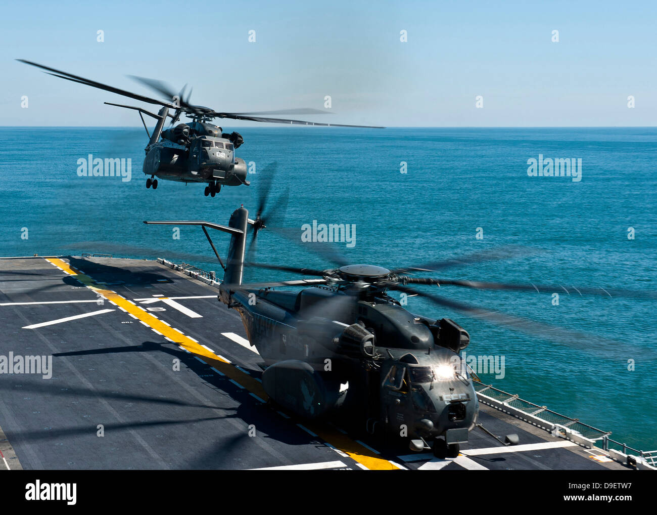 MH-53E Sea Dragon helicopters take off from the flight deck of USS Wasp ...