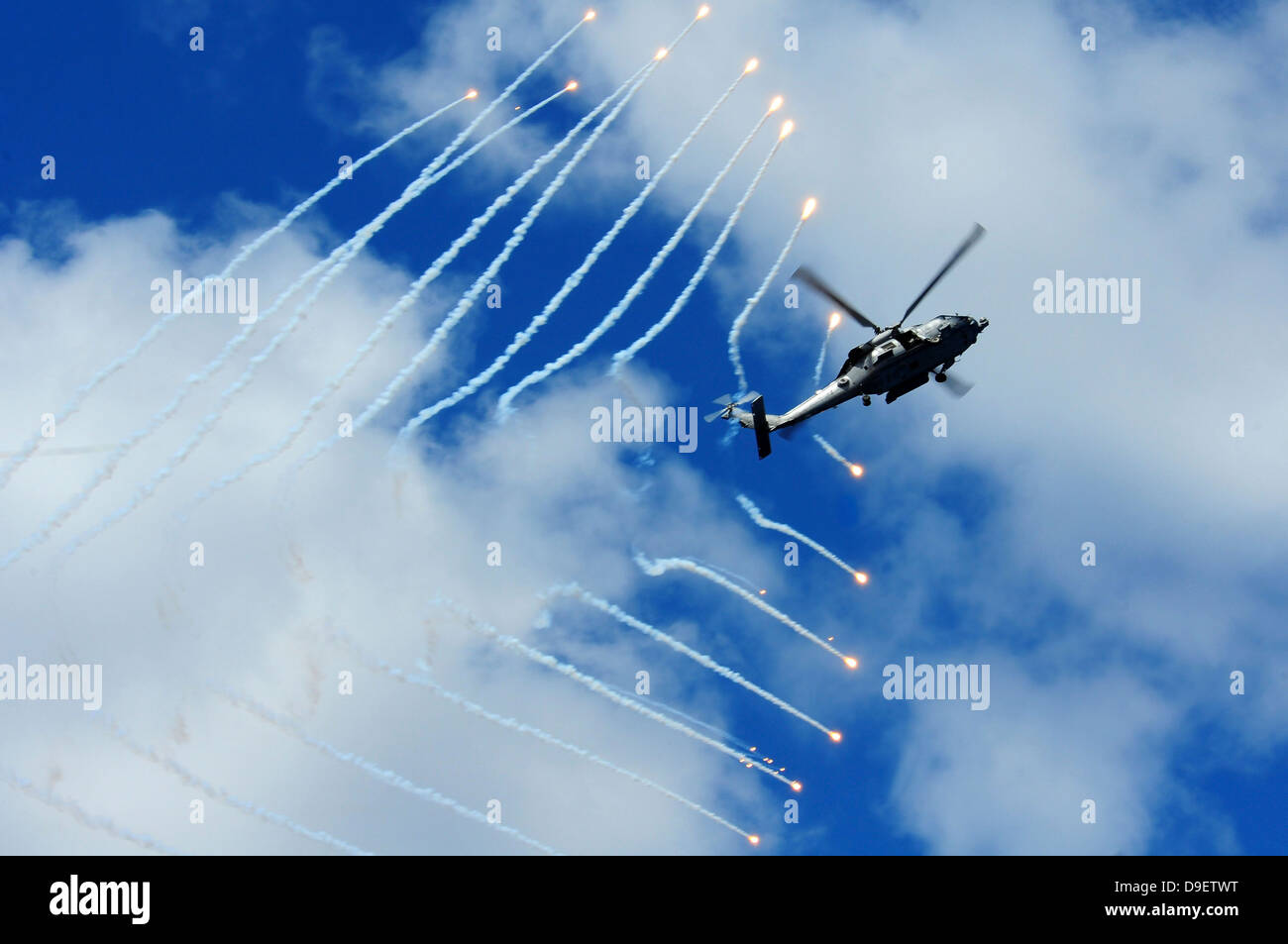 An HH-60H Sea Hawk helicopter releases countermeasure flares Stock ...