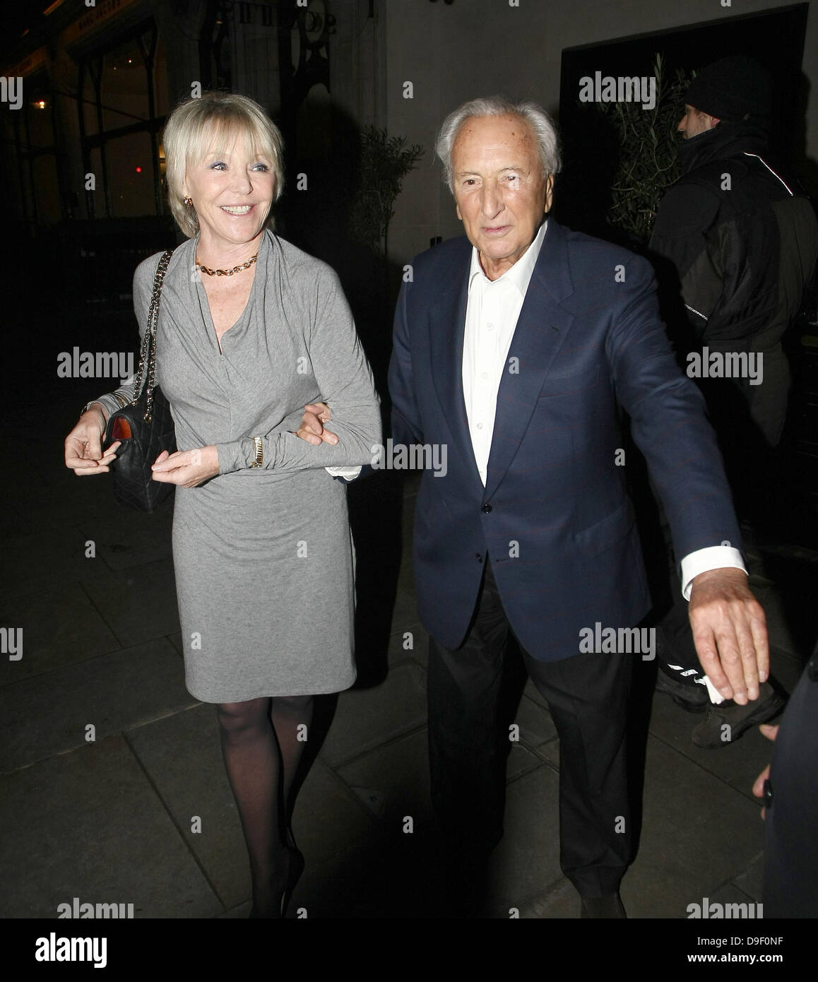 Michael Winner and a friend leave Scott's restaurant in Mayfair London ...