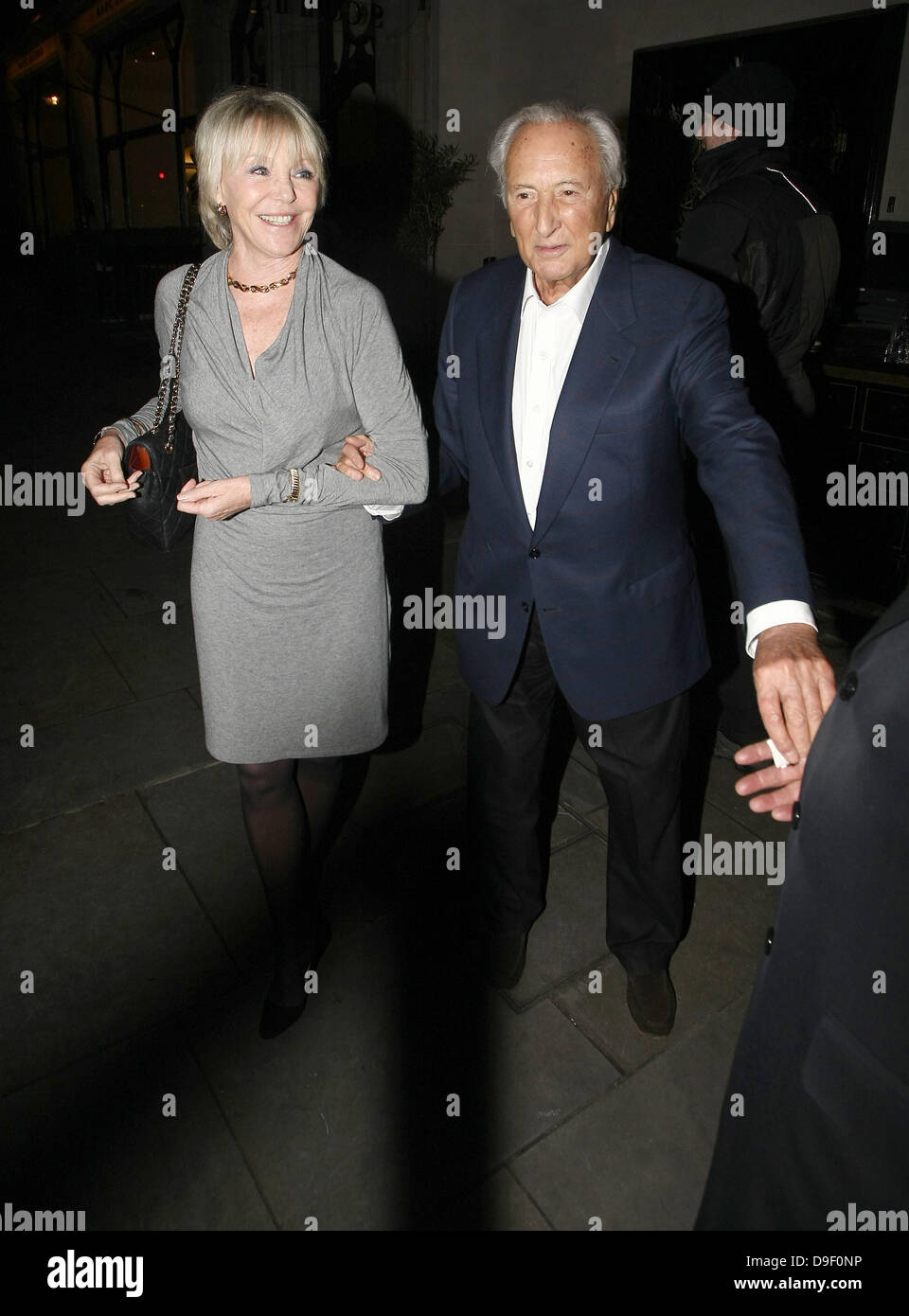Michael Winner and a friend leave Scott's restaurant in Mayfair London ...