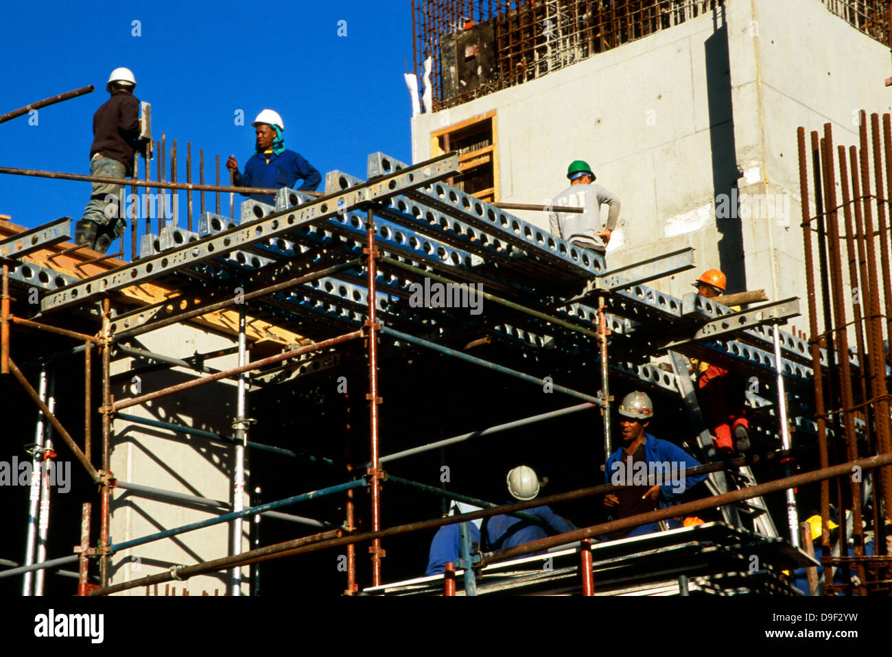 Construction workers work on the extention of the Cape Town ...