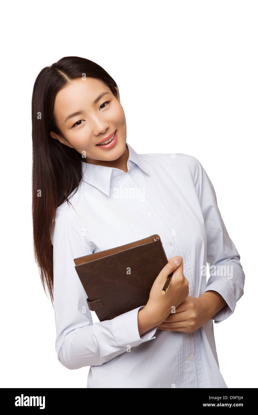 Businesswoman reading documents smiling camera hi-res stock photography ...