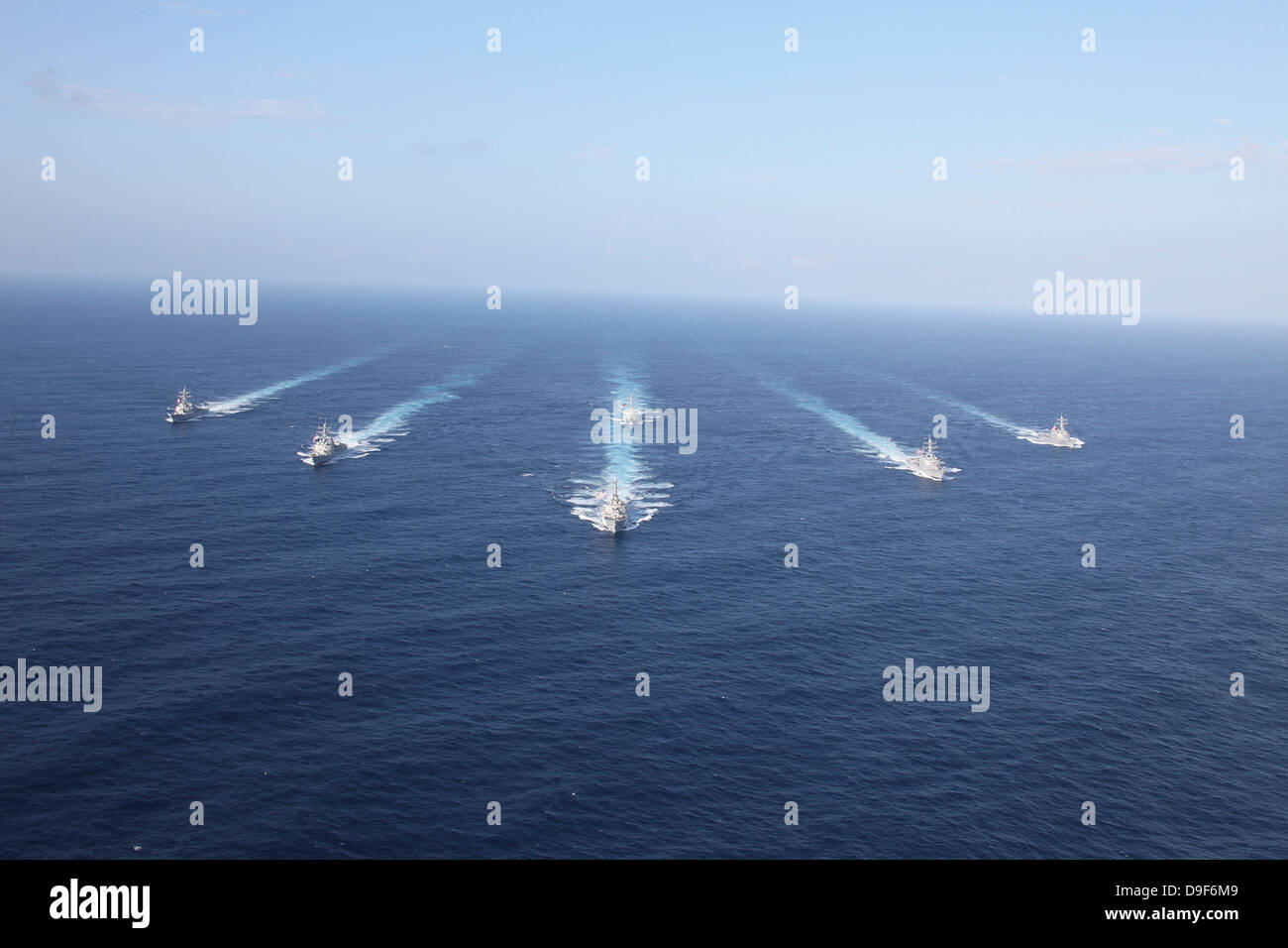 Military ships transit the Philippine Sea in formation Stock Photo - Alamy