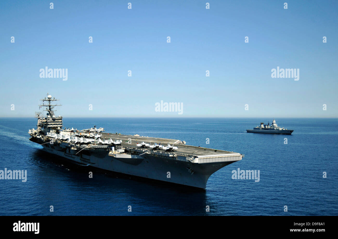 USS Harry S. Truman cruises alongside the German Navy frigate FGS ...