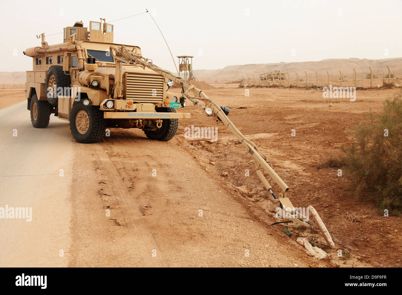 A MRAP vehicle disassembles an improvised explosive device Stock Photo ...