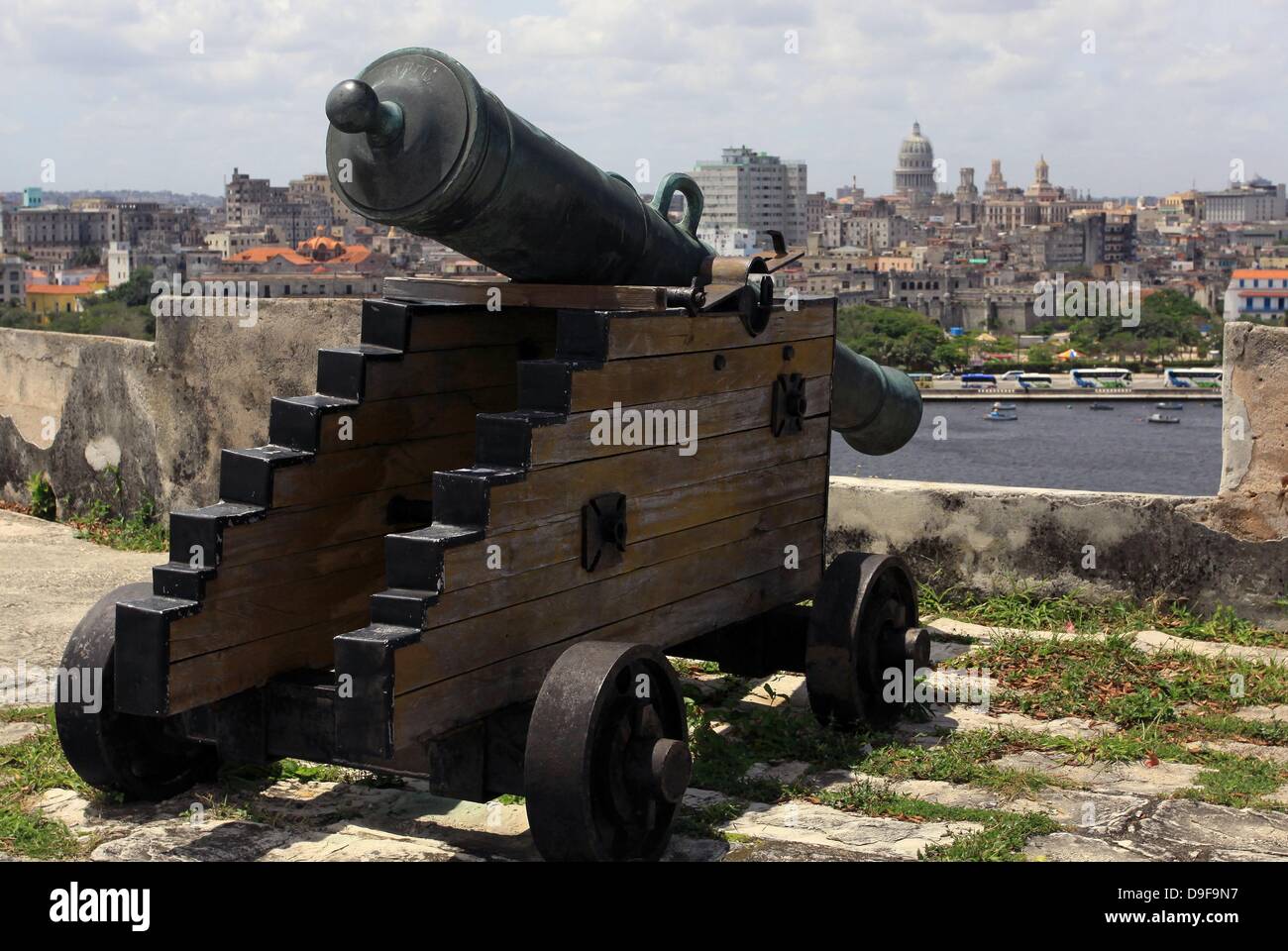 A historic cannon stands on the ramparts of fortress Castillo de los ...