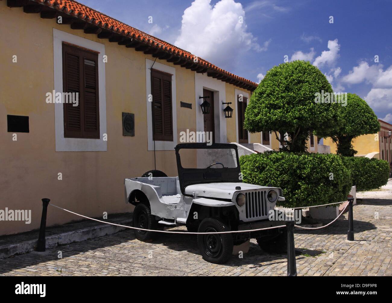 A historic jeep is parked in front of the former heasquarters of ...