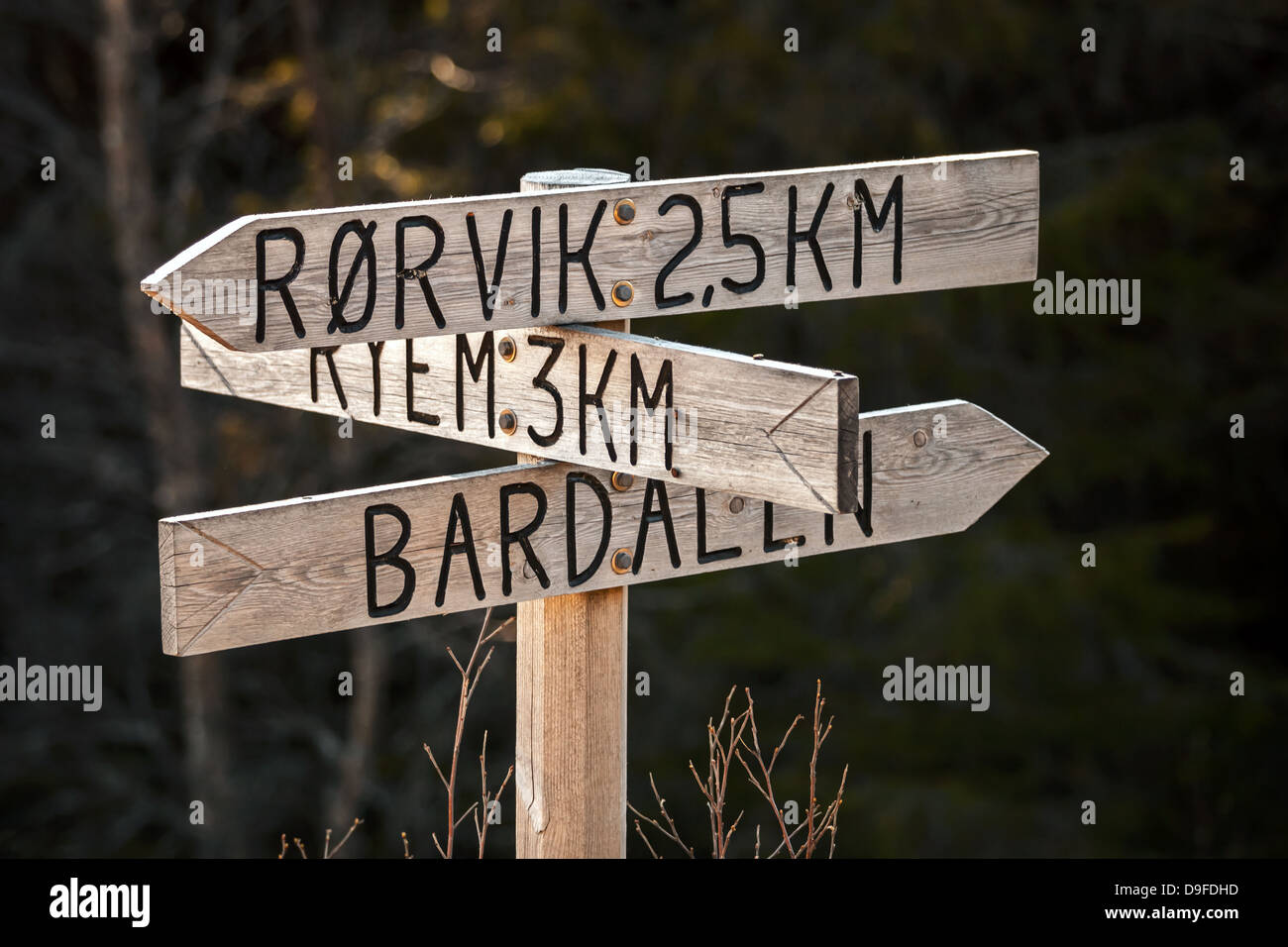 Wooden Road sign with villages names in Norway Stock Photo - Alamy