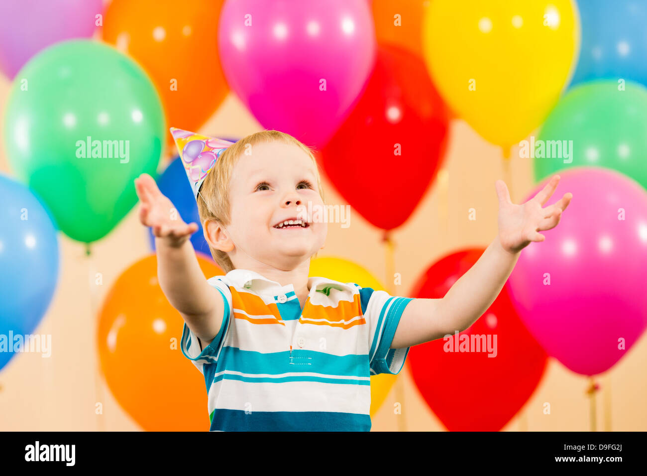smiling child boy with balloons on birthday party Stock Photo - Alamy