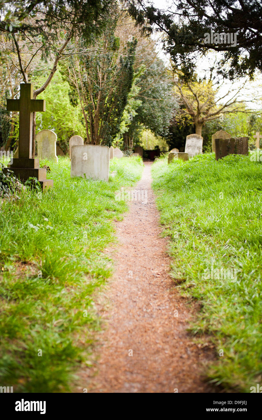 a walking path through an English graveyard Stock Photo - Alamy