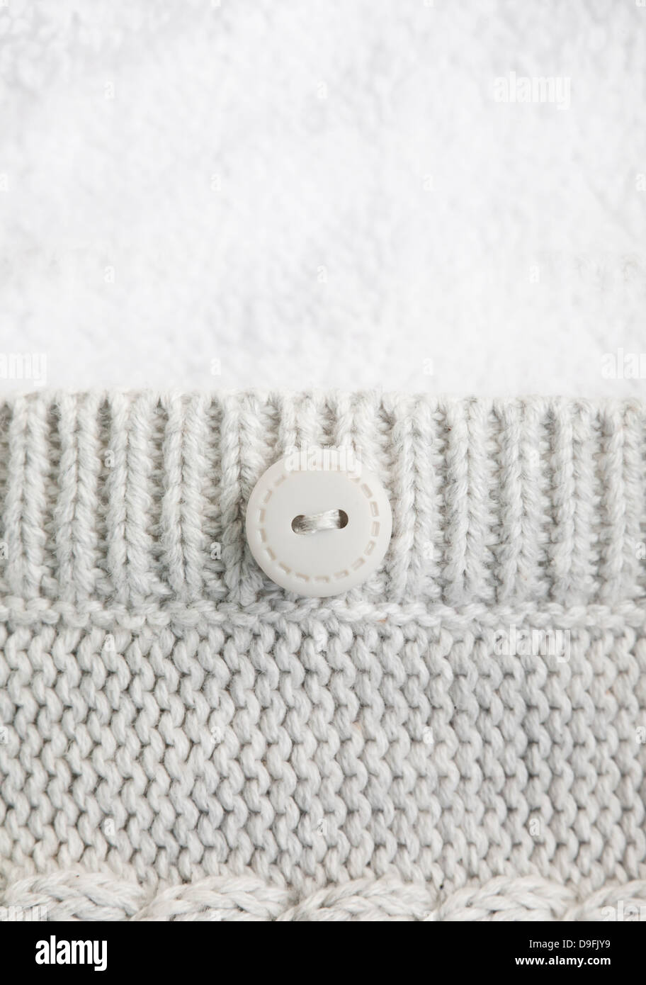 Button on wool fabric Stock Photo - Alamy