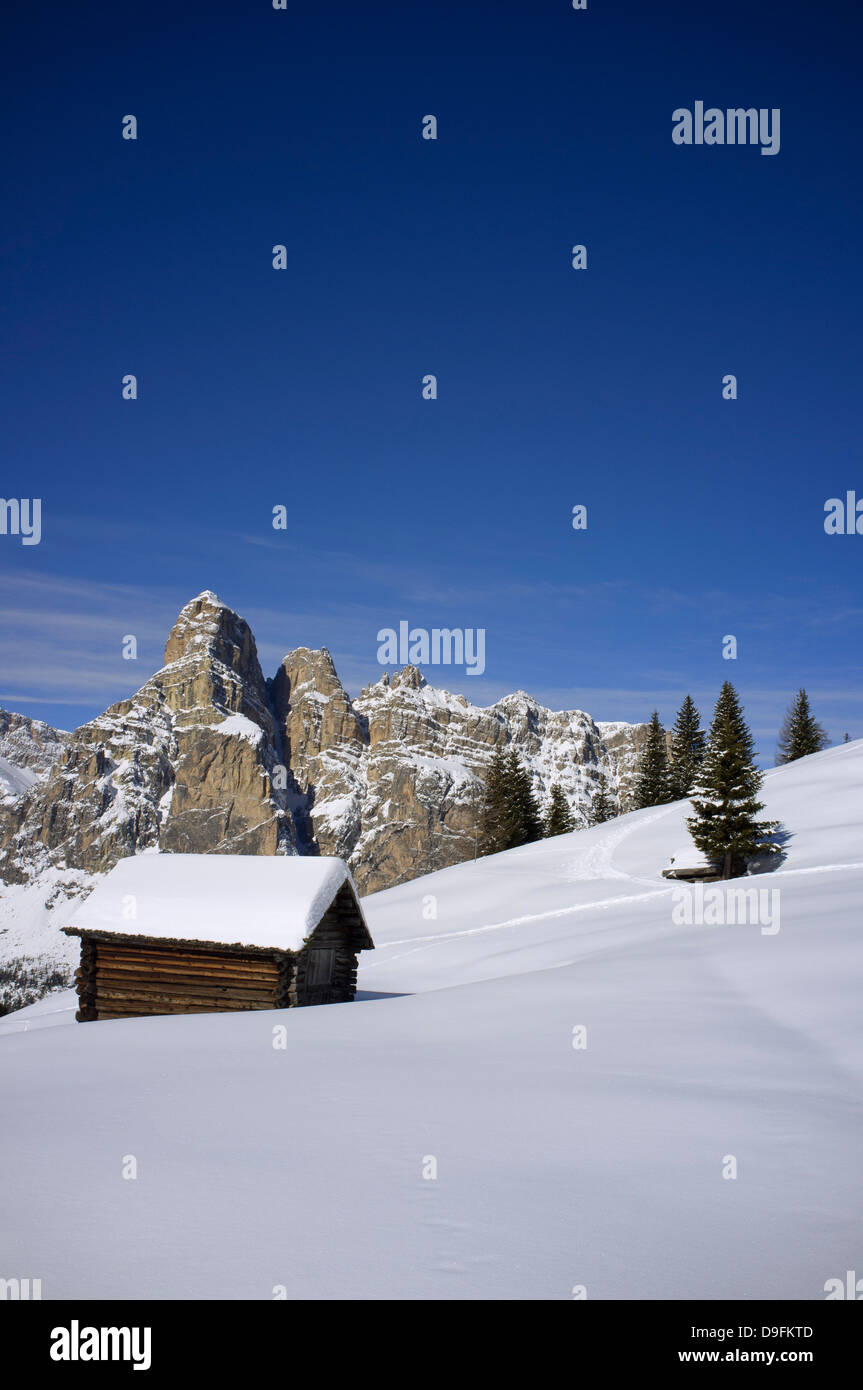 Barn at the Alta Badia ski resort and Sassongher mountain behind ...