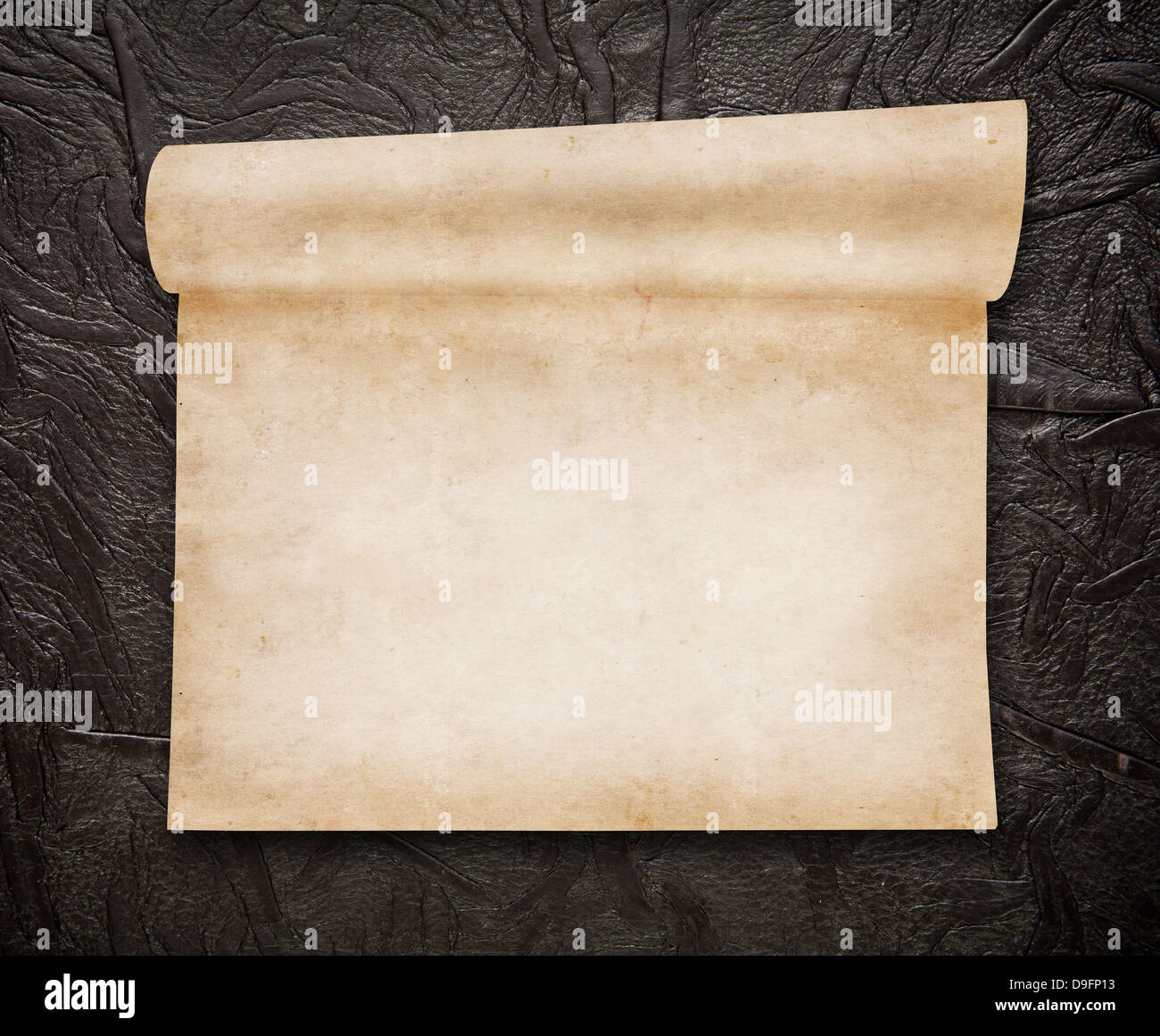 Aged scroll paper, old leather on background Stock Photo - Alamy